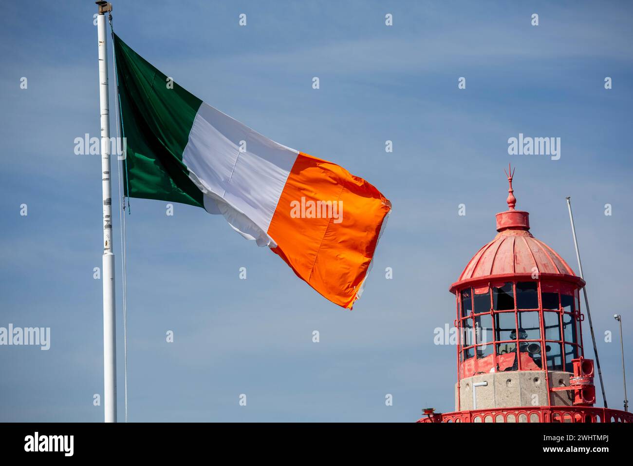 Irish tricolour national flag blowing in the brezze at Dun Laoghaire ...