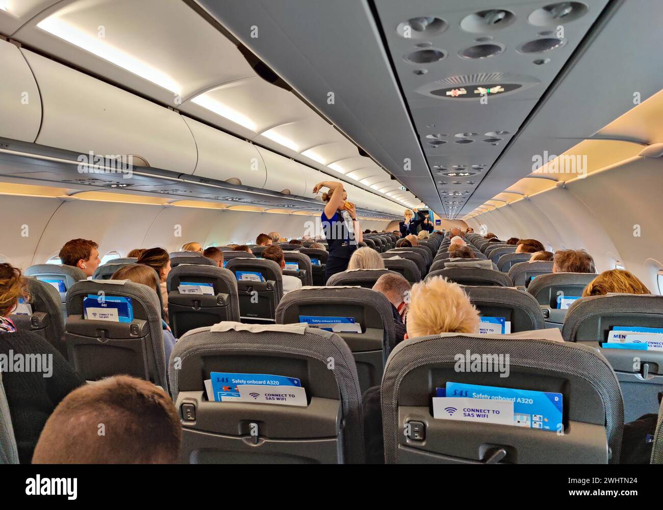 Passengers in the interior of an aircraft during the safety ...