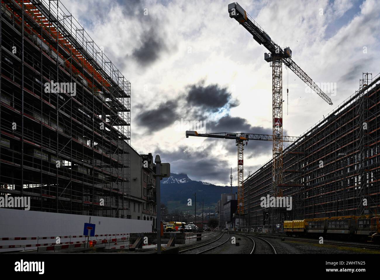 Scaffolding and construction cranes Stock Photo - Alamy