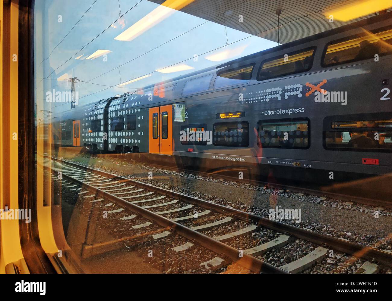 View from a train onto a double-decker regional train operated by ...