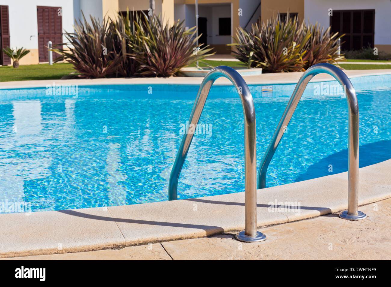 Outdoor Swimming pool with Ladder Stock Photo - Alamy