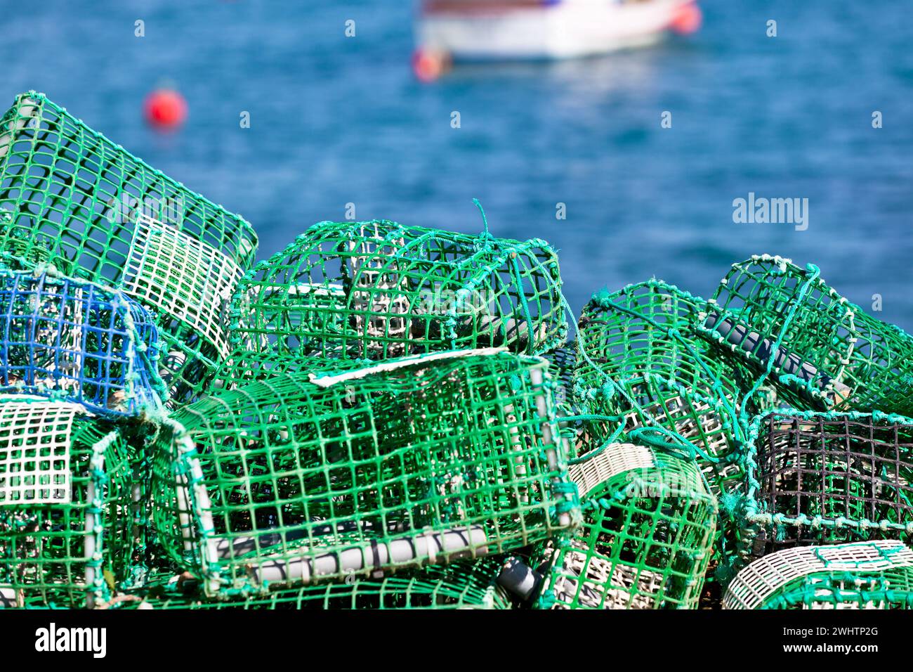 Lobster and Crab traps stack in a port Stock Photo - Alamy