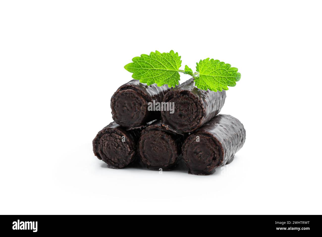 Chocolate covered waffer rolls isolated on white Stock Photo - Alamy