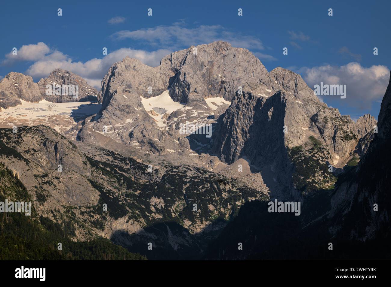 Amazing view to peaks of huge mountains around Dachstein. Alpine peaks ...