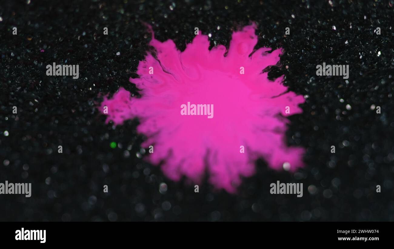 Ink drop paint splatter pink blotch glitter black Stock Photo - Alamy