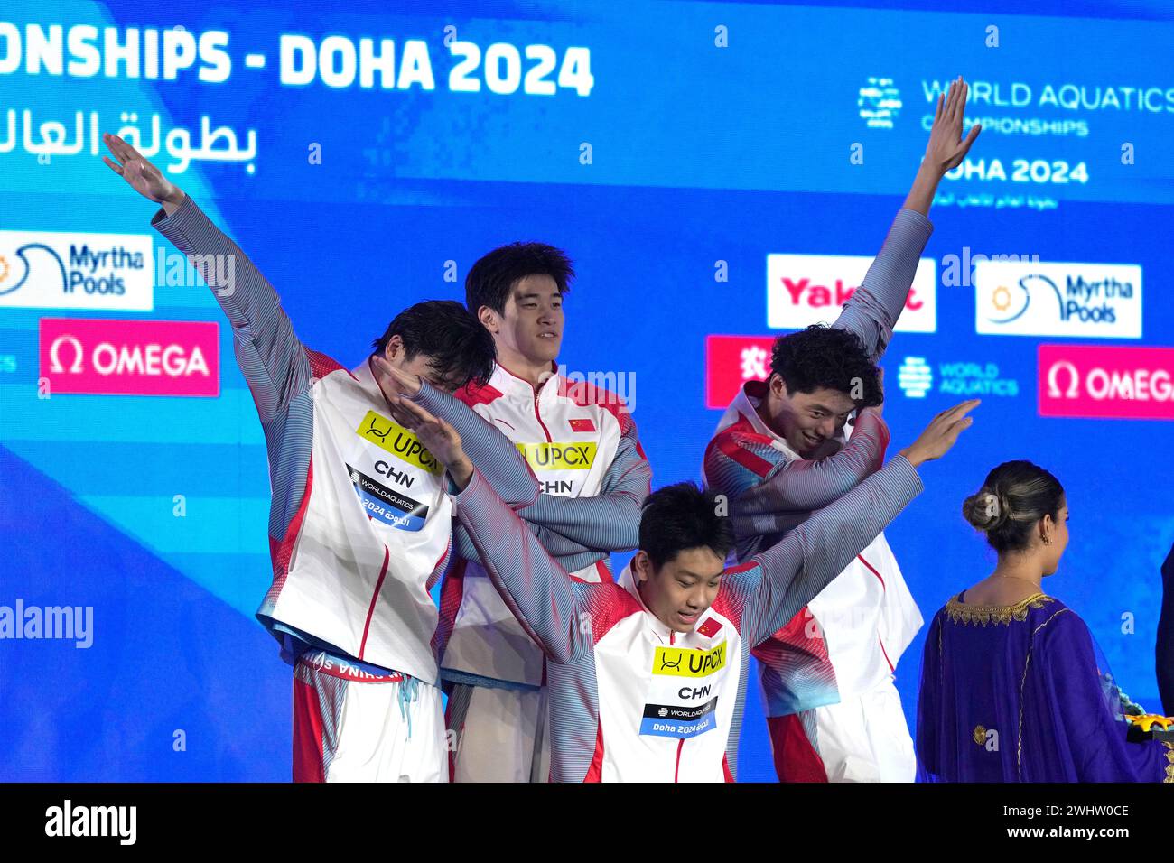 Gold medalists team China, react during the medal ceremony for the men's 4x100-meter freestyle ...