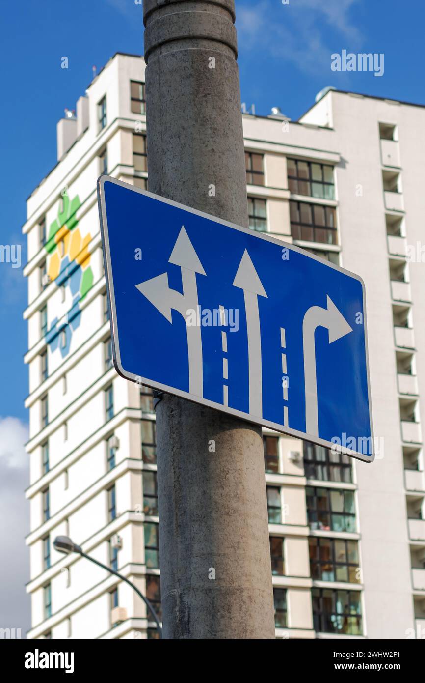 Blue road sign with arrow pointers close up Stock Photo - Alamy