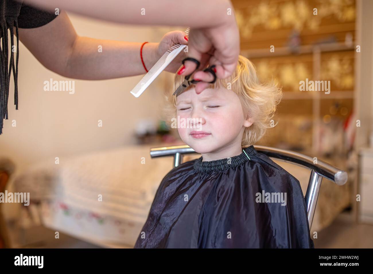 kid gets pampered with a new haircut and hairstyle by a skilled ...