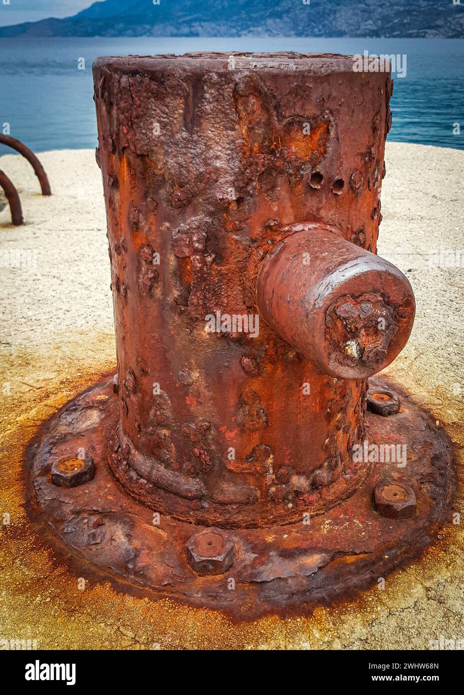 In the harbor, a rusty bollard Stock Photo - Alamy