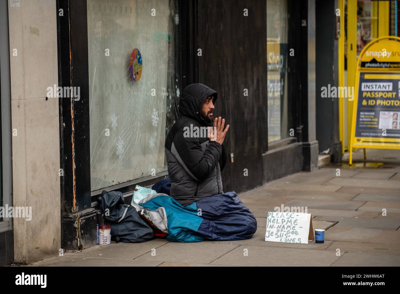 Homeless man praying on the streets of Oxford Stock Photo - Alamy