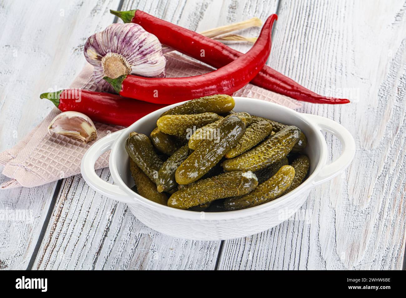 Marinated small cucumbers - cornichon - in the bowl Stock Photo - Alamy