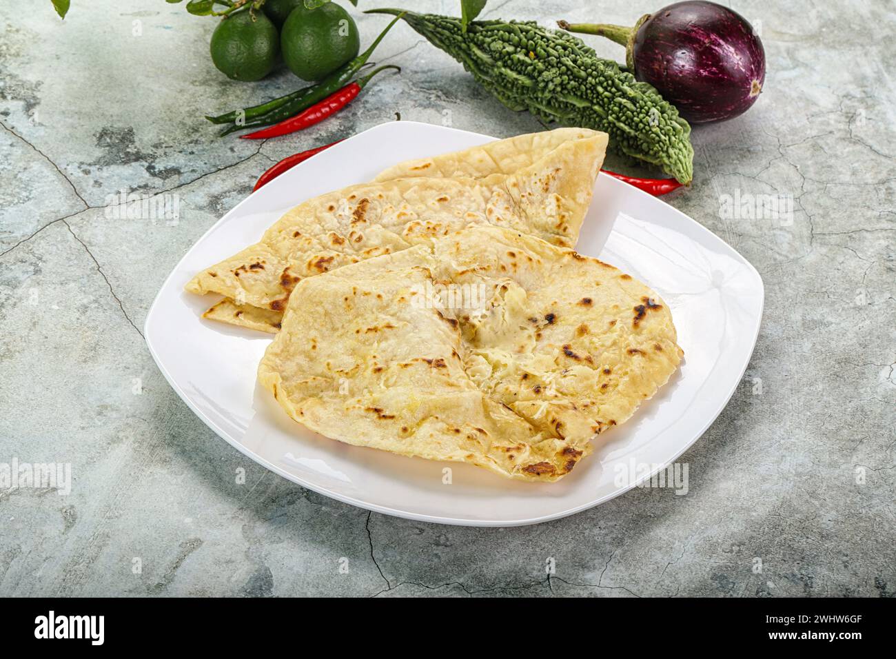 Indian cuisine tandori bread - naan with cheese Stock Photo - Alamy