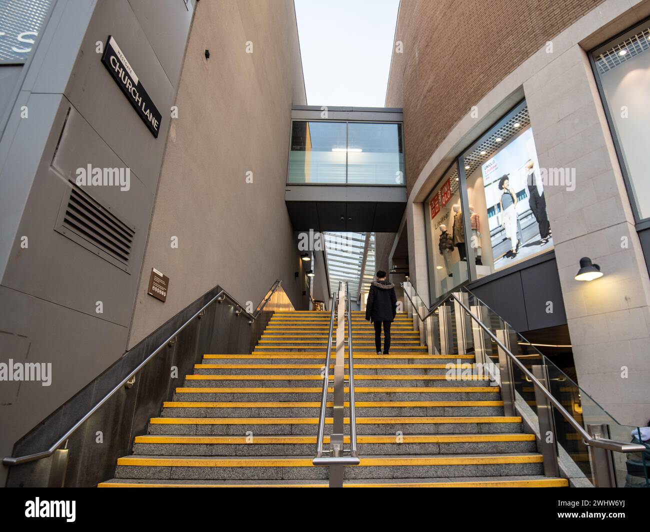 Church Lane, person walking up yellow stairs, Westgate Stock Photo - Alamy