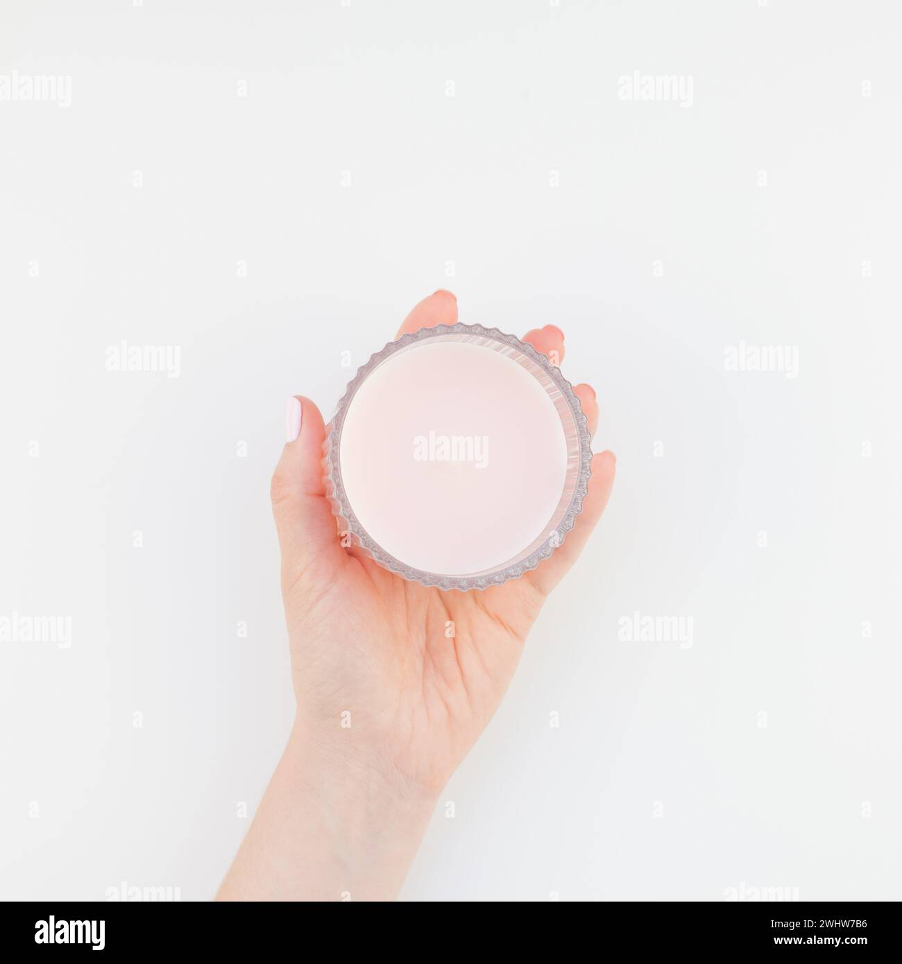 Pink feminine background hand hi-res stock photography and images - Alamy