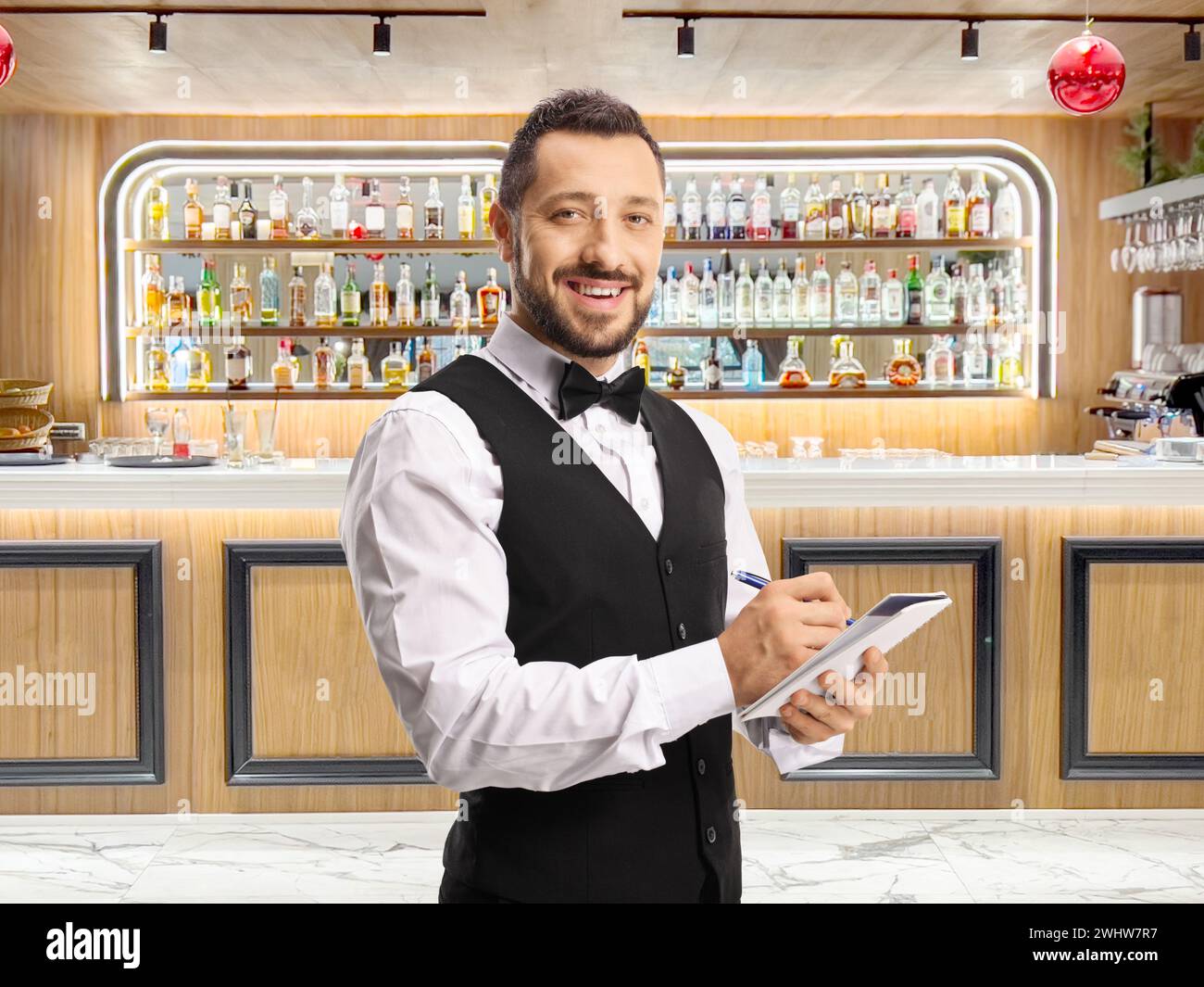 Male waiter in suit hi-res stock photography and images - Alamy
