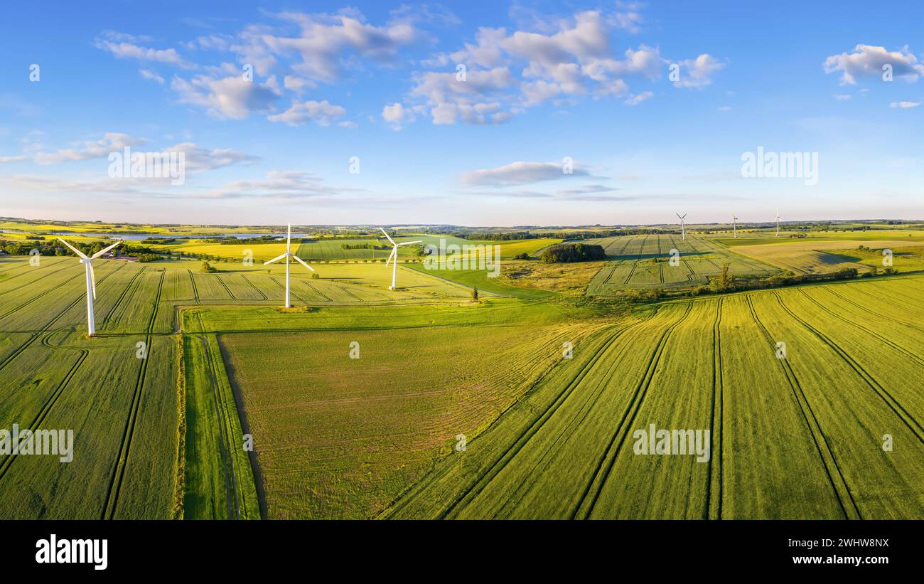 Wind turbines that produce electricity, built on a field in Skanderborg ...