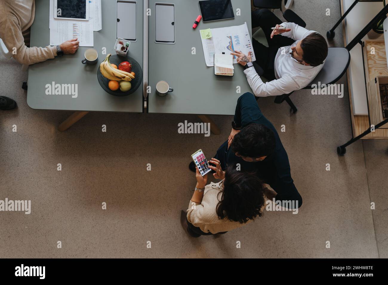 Company colleagues collaborating on innovative business strategies in ...