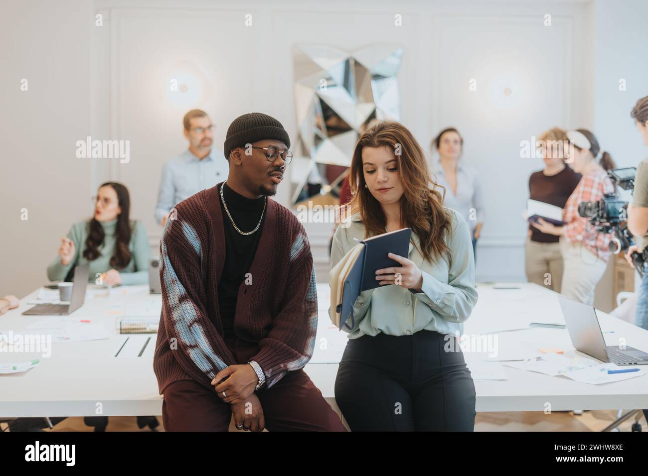 Multi generational, mixed race group of company employees engaging in a ...