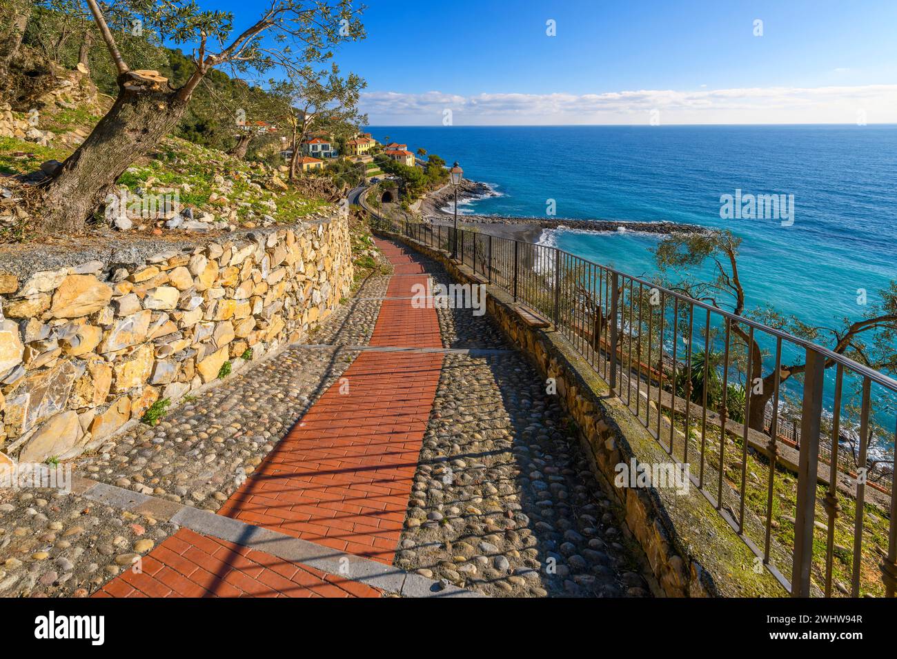 The narrow stone hillside walkway leading to the medieval hill town of ...