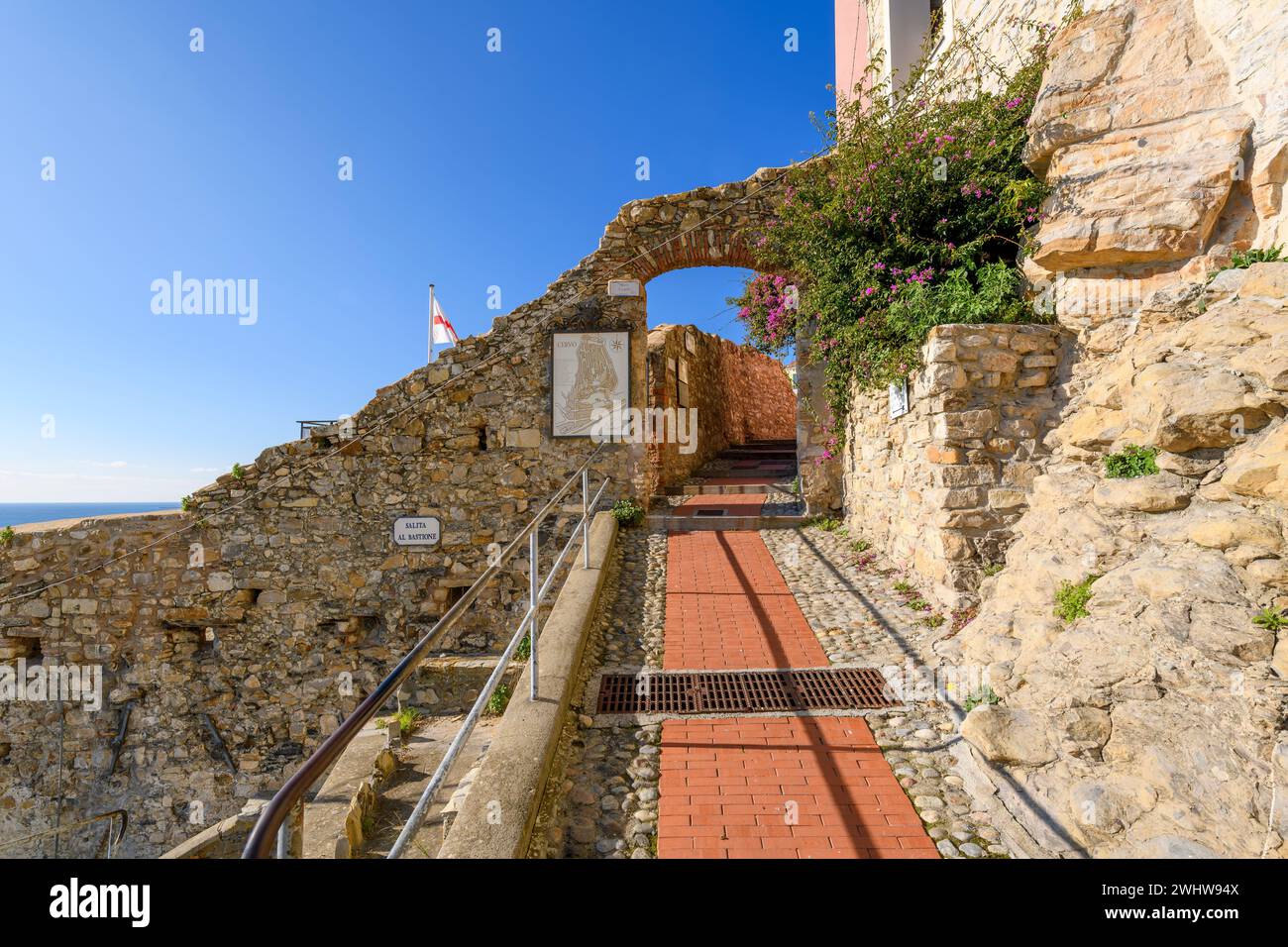The narrow stone hillside walkway leading to the medieval hill town of ...