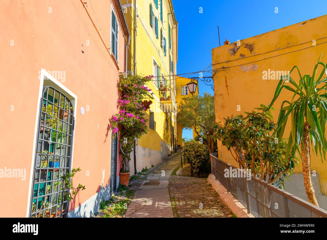 The narrow stone hillside walkway leading to the medieval hill town of ...