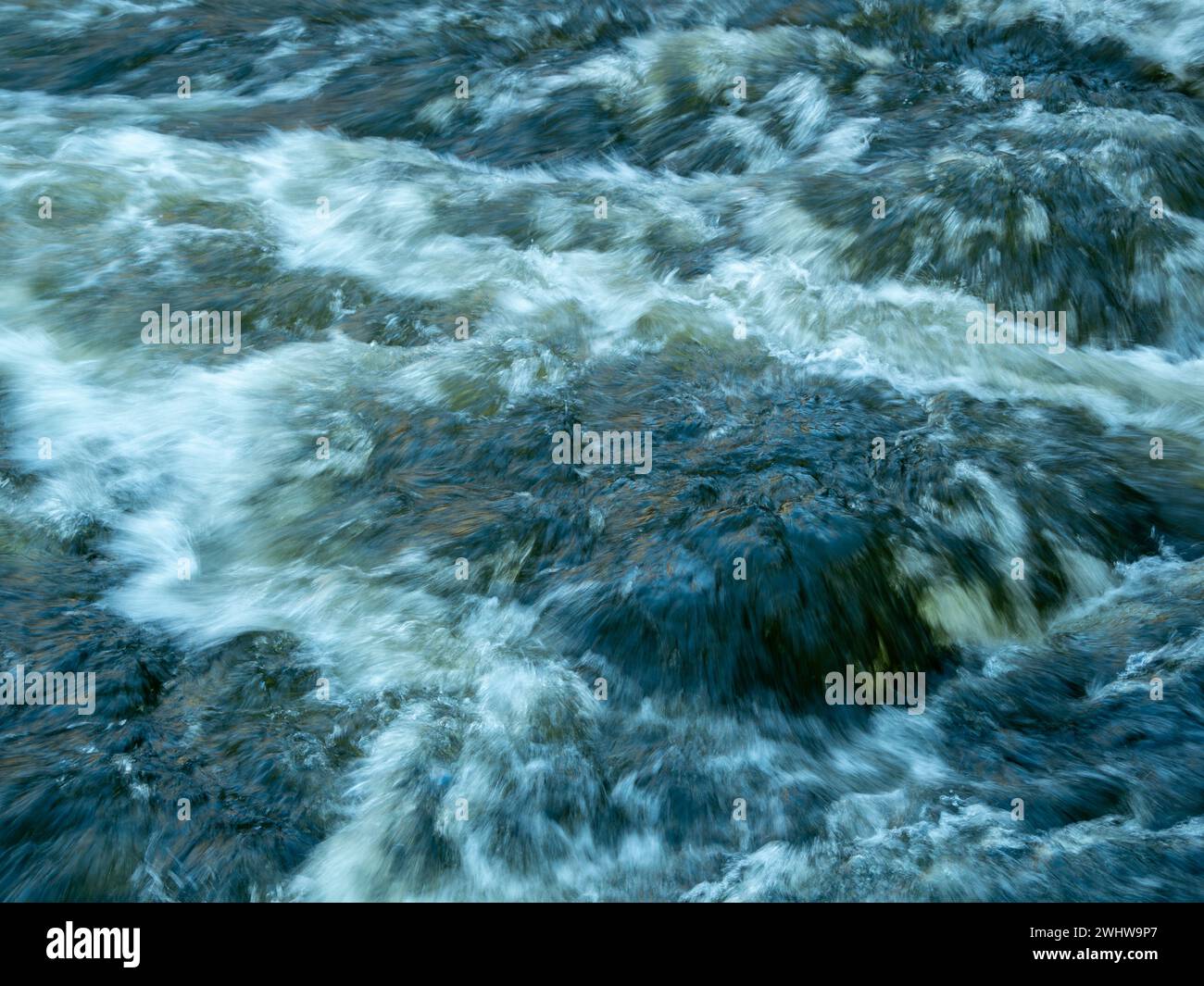 Seething water in a water channel. Fast flowing water of a water ...