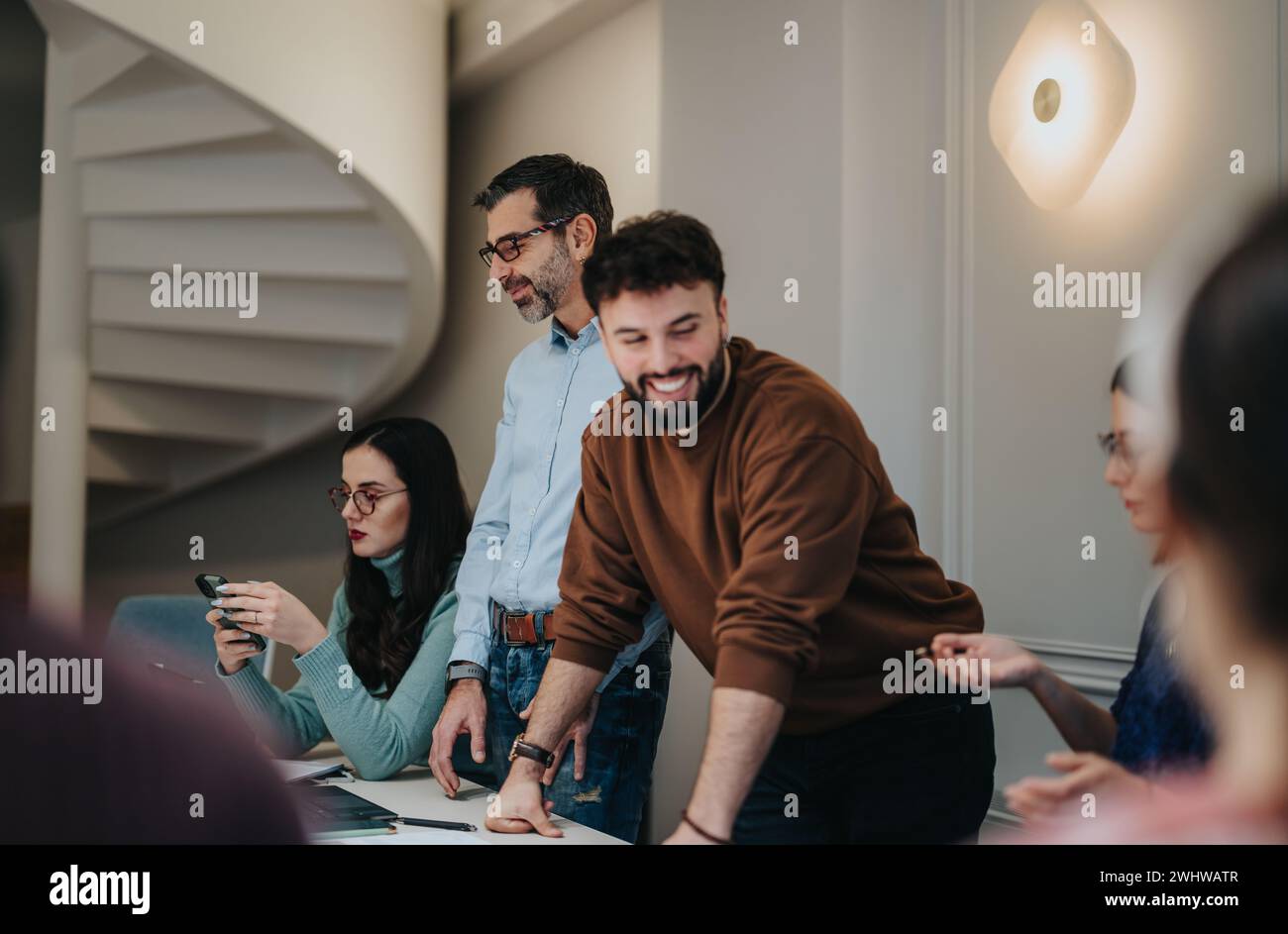 Dynamic image of a collaborative team engaging in a discussion at a ...