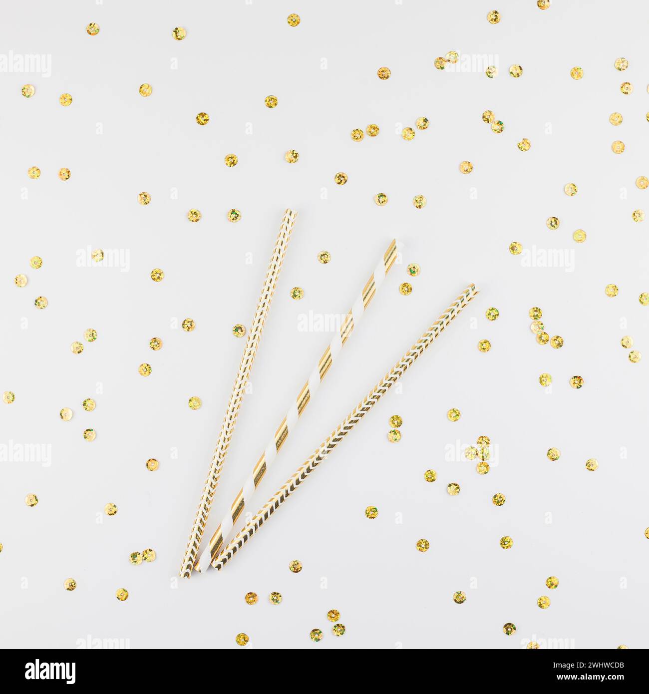Cocktail party straws with golden sparkles Stock Photo - Alamy