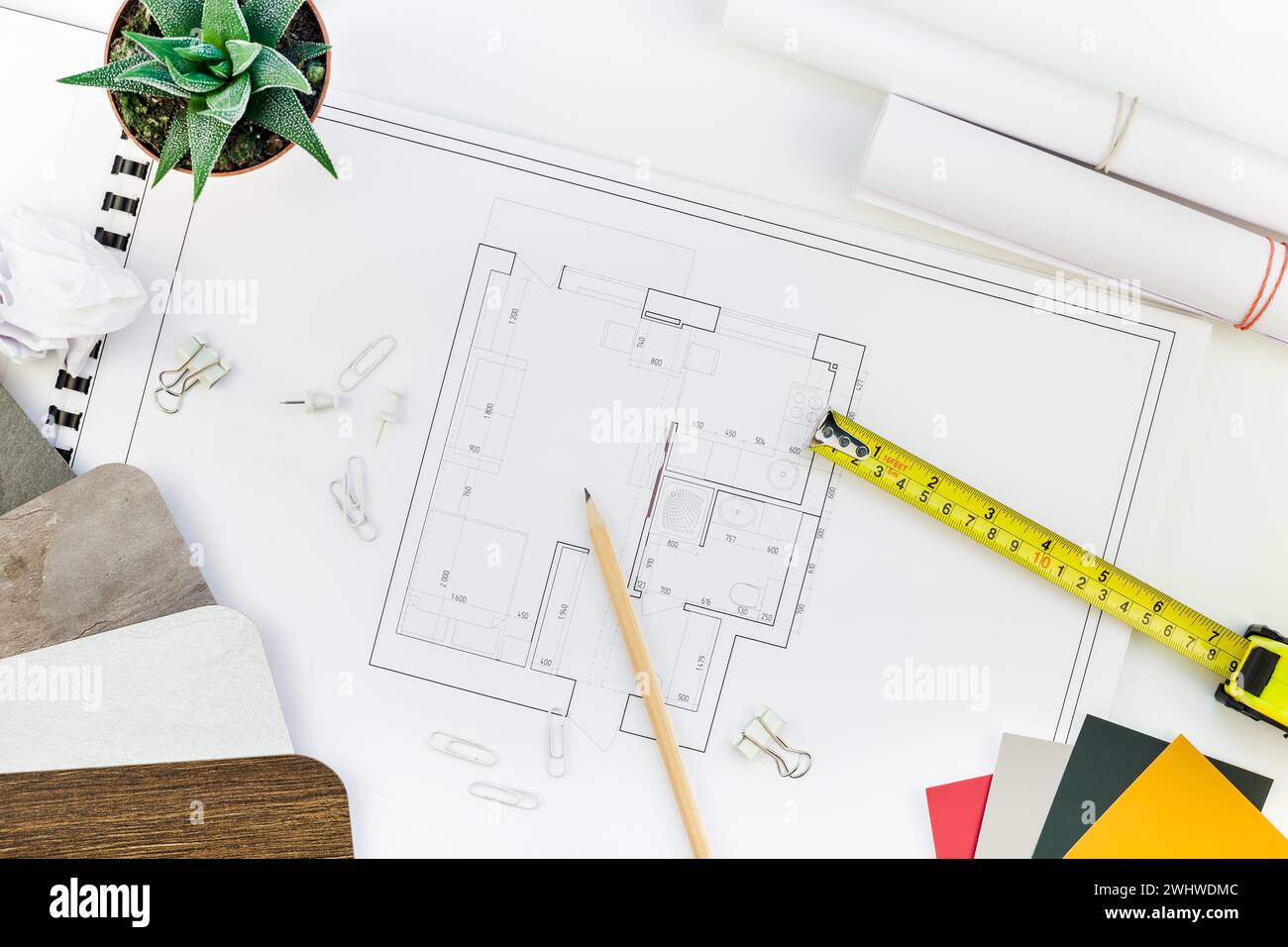 Interior designer table workplace with house plan Stock Photo - Alamy