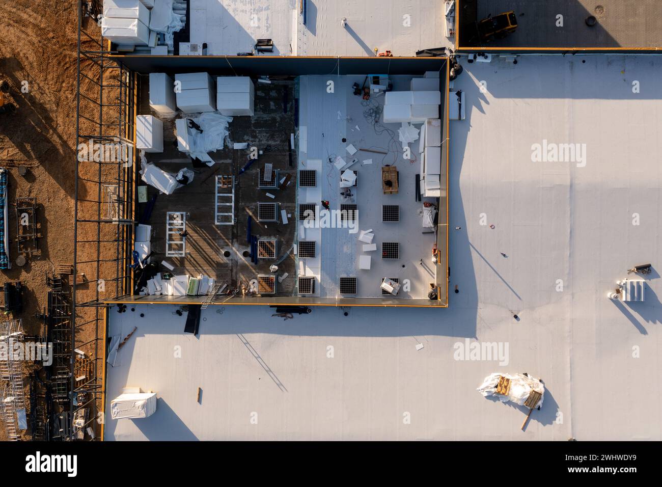 Drone photography of warehouse rooftop construction during autumn sunny ...