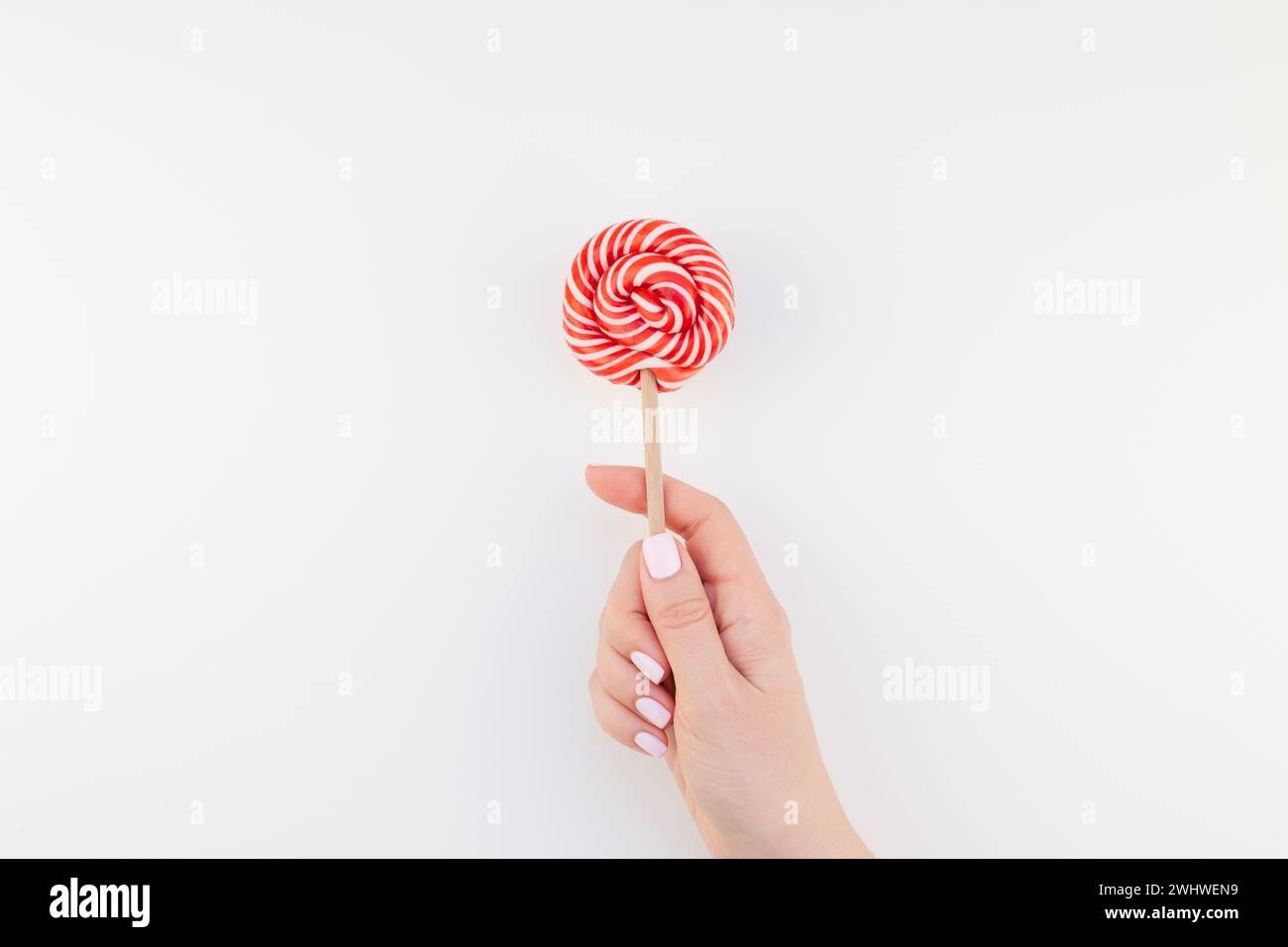 Lollipop holding hand hi-res stock photography and images - Alamy