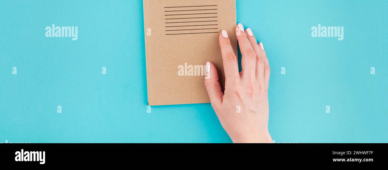 Woman hands holding craft paper diary Stock Photo - Alamy