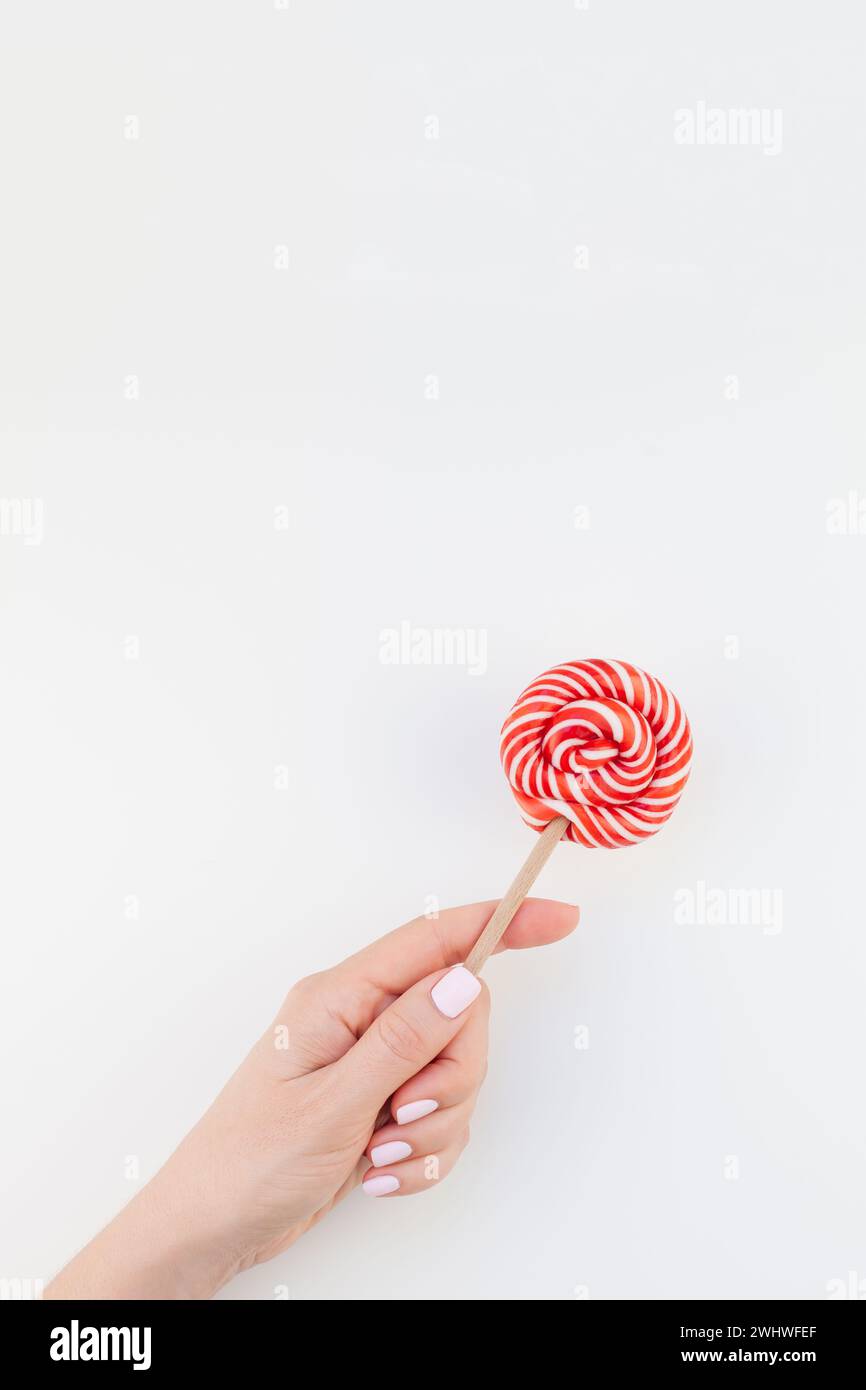 Lollipop holding hand hi-res stock photography and images - Alamy