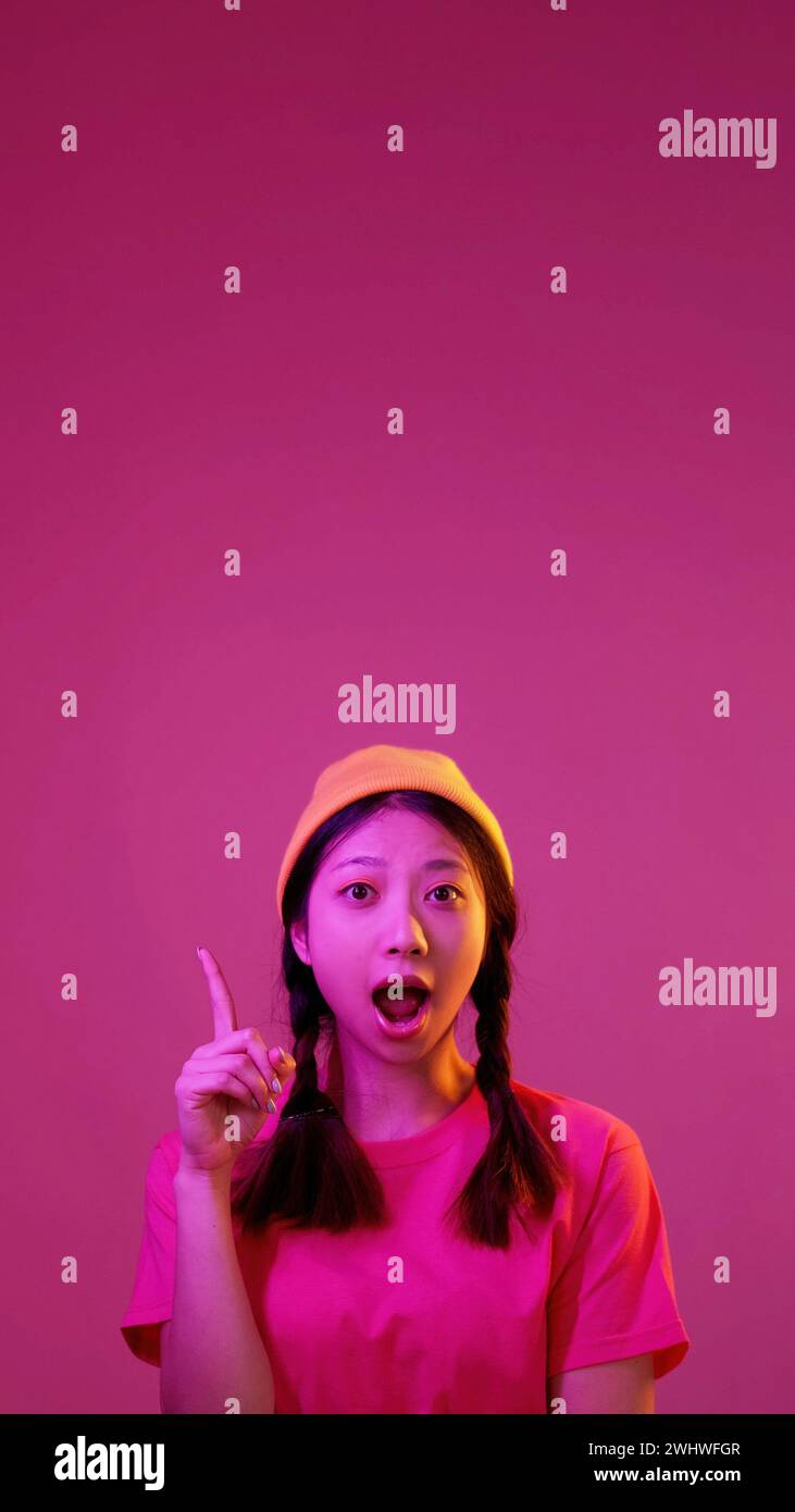 Great idea eureka woman pointing finger up thought Stock Photo - Alamy