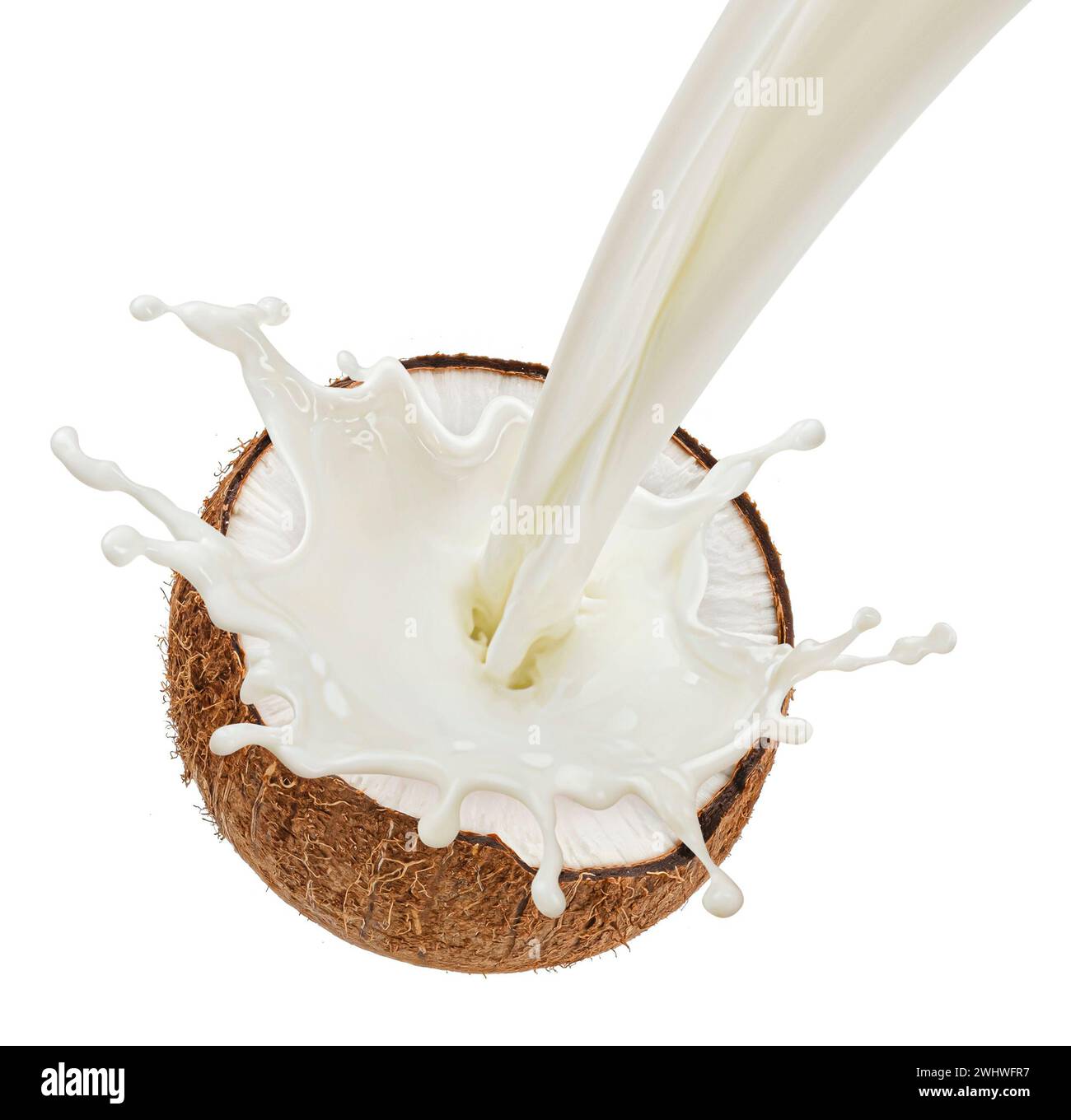 Coconut milk splash isolated on white background Stock Photo - Alamy