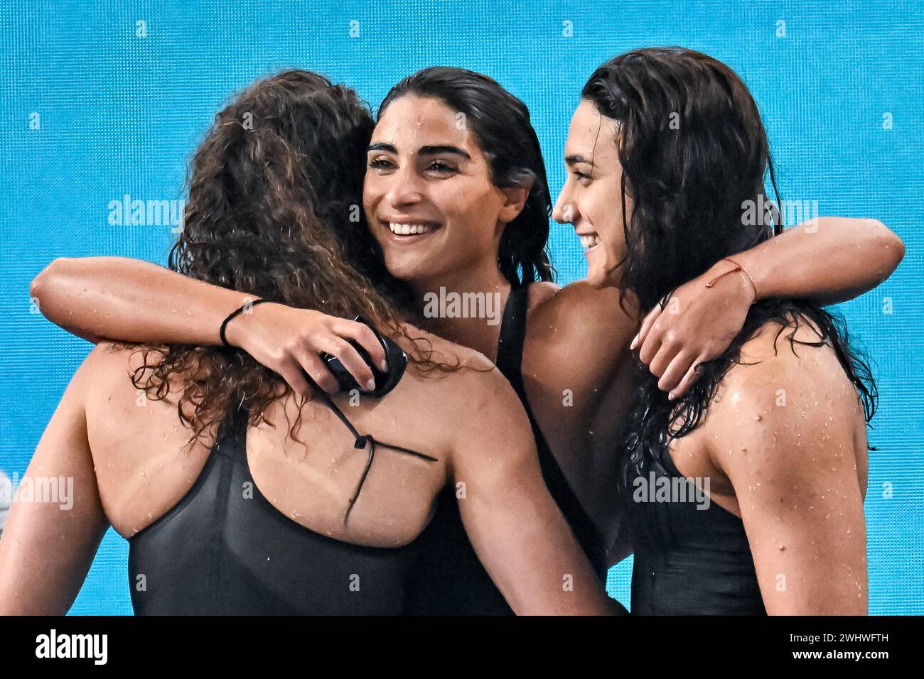 Doha, Qatar. 11th Feb, 2024. Athletes of team Italy react after ...