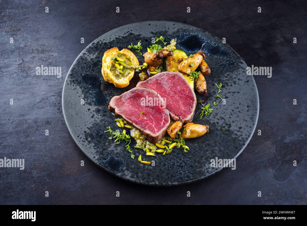 Fried Italian chianina beef fillet steak very rare with mushrooms Stock ...