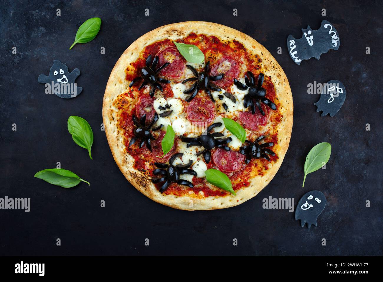 Traditional Italian Halloween spider pizza with salami Stock Photo - Alamy