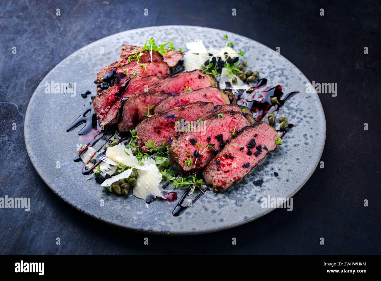 Italian tagliata de manzo roast beef steak slices with parmesan and ...