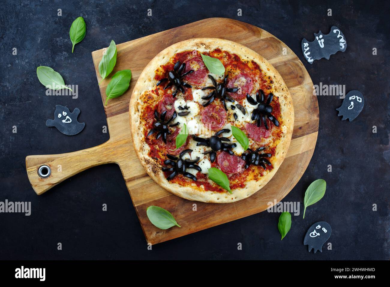 Traditional Italian Halloween spider pizza with salami Stock Photo - Alamy