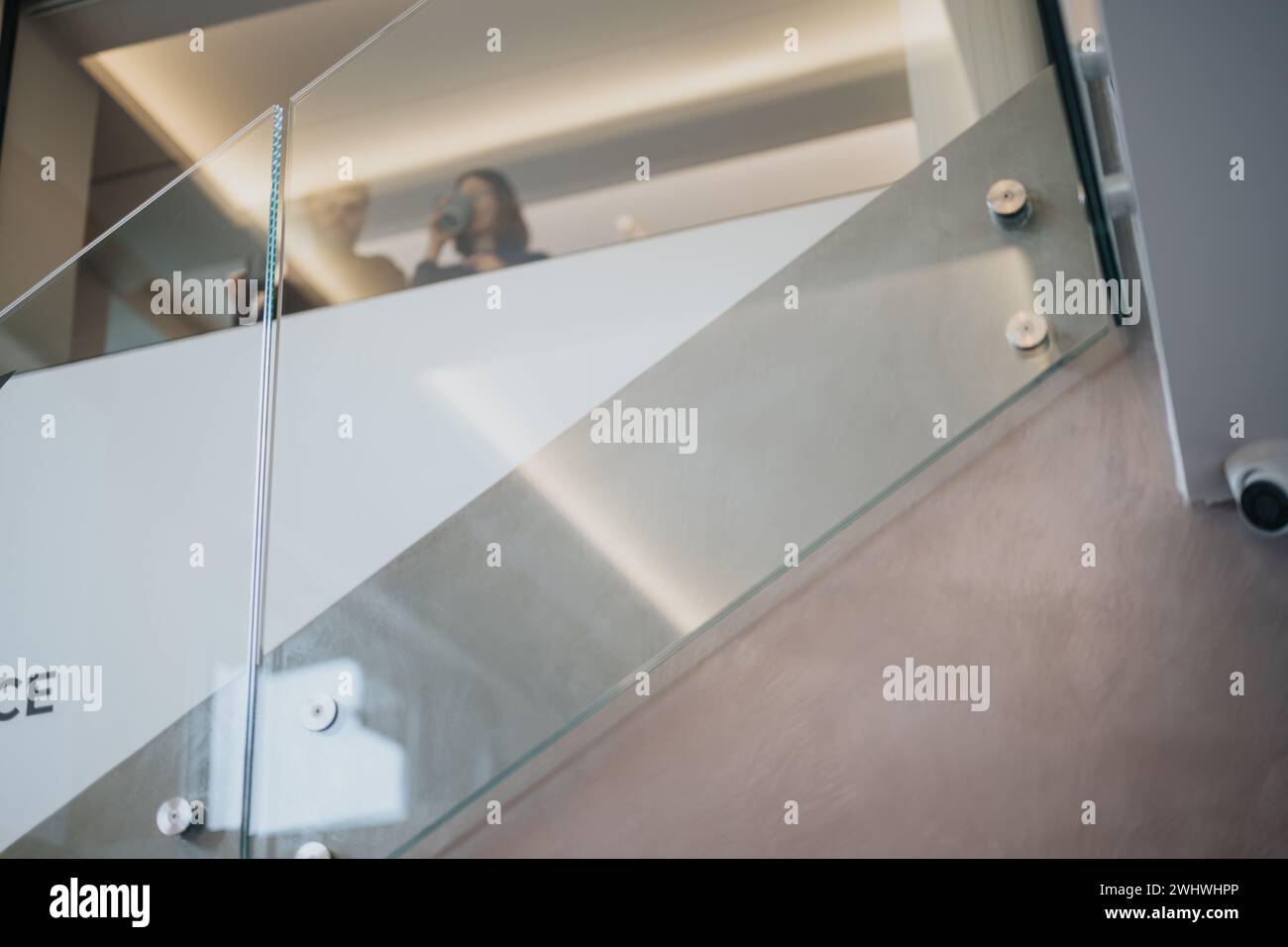 Modern office interior with glass walls and reflective surfaces Stock ...