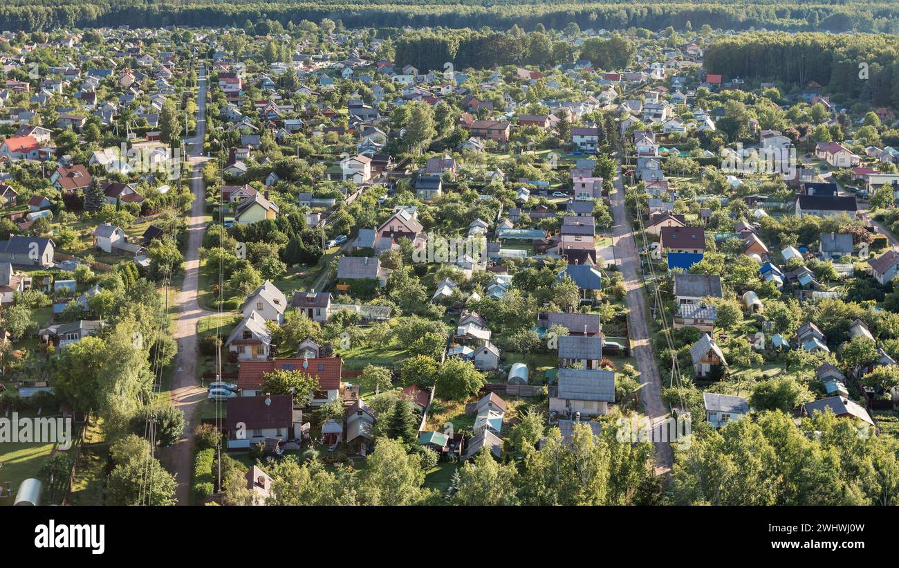 Aerial view of housing estate. Summer morning, village surrounded by ...