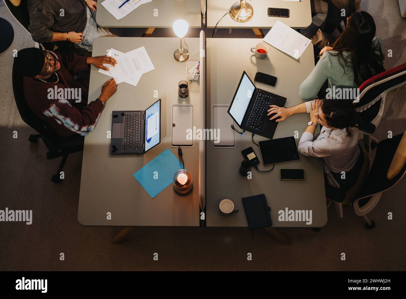 Top view of multigenerational business colleagues collaborating in a ...