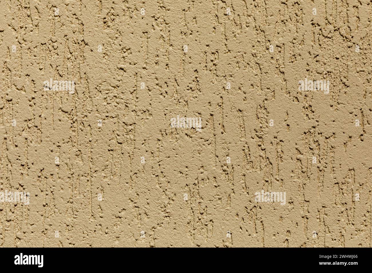 Sand decorative relief . Yellow-brown stucco wall. Background of the ...