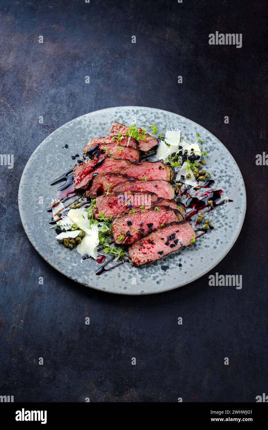 Italian tagliata de manzo roast beef steak slices with parmesan and ...