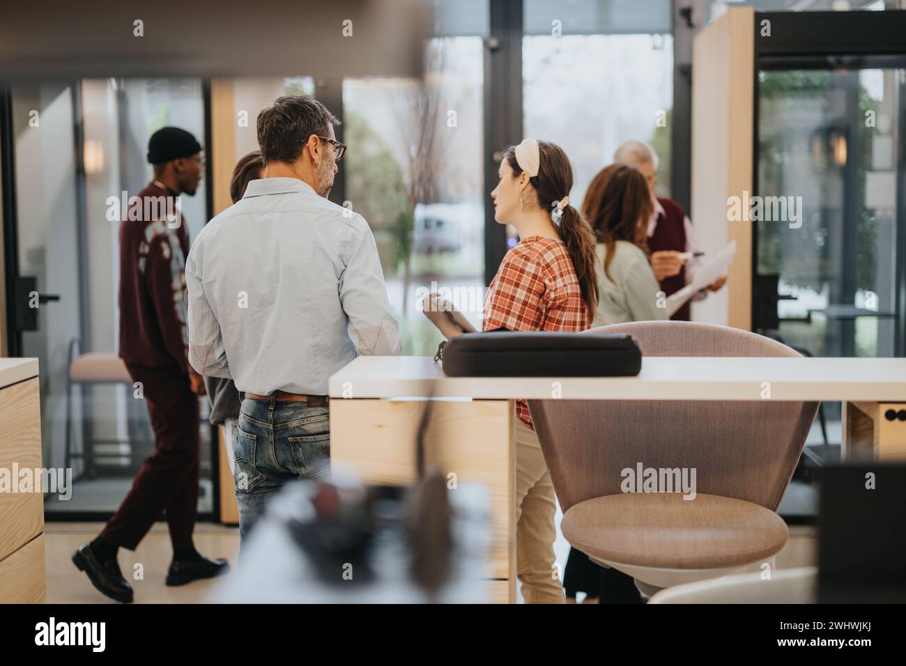 Diverse group colleagues engage hi-res stock photography and images - Alamy