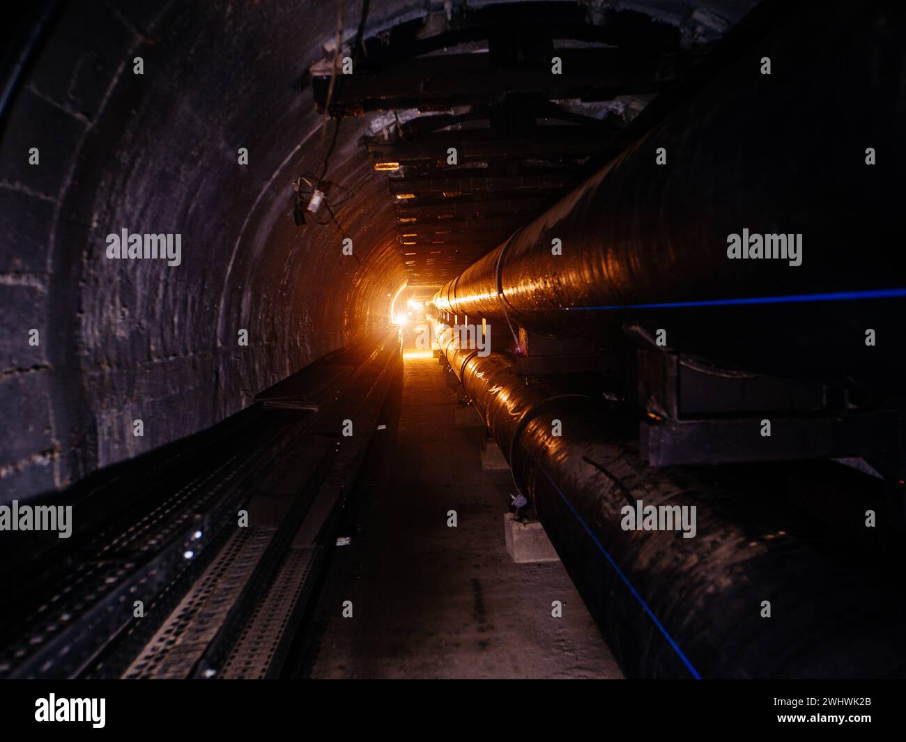 Round concrete underground tunnel of sewer, heating duct or water ...