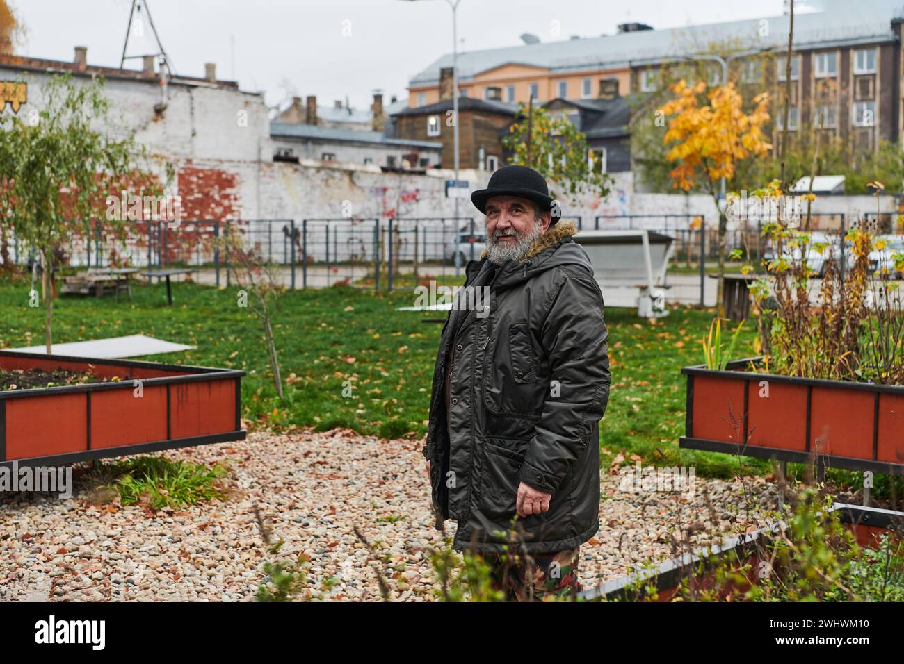In the historic city of Riga, a bearded elderly man passionately ...