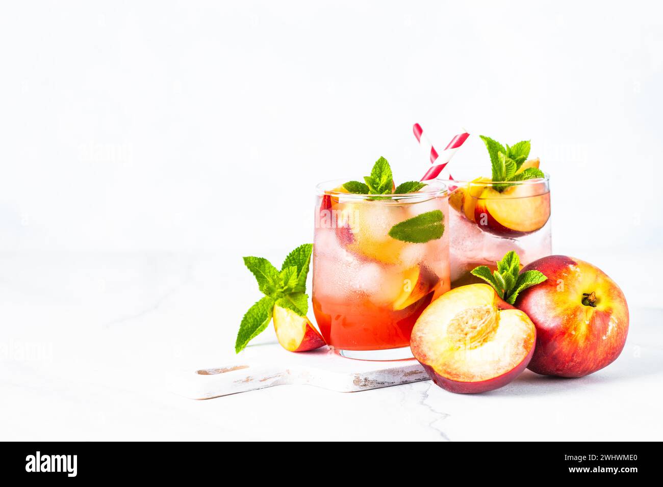 Peach cocktail, iced peach tea, fruit drink Stock Photo - Alamy