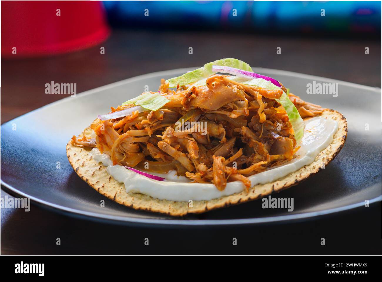 Tostada with Mexican Chicken Tinga, Tinga de Pollo Stock Photo - Alamy
